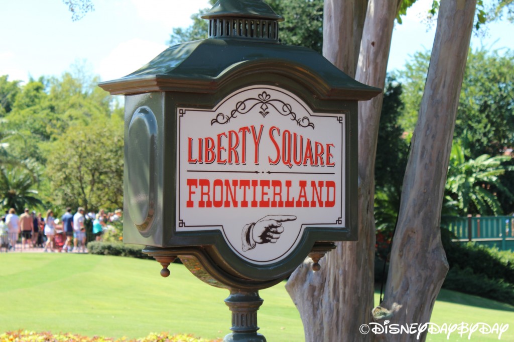 Liberty Square and Frontierland Sign Magic Kingdom | DisneyDayByDay